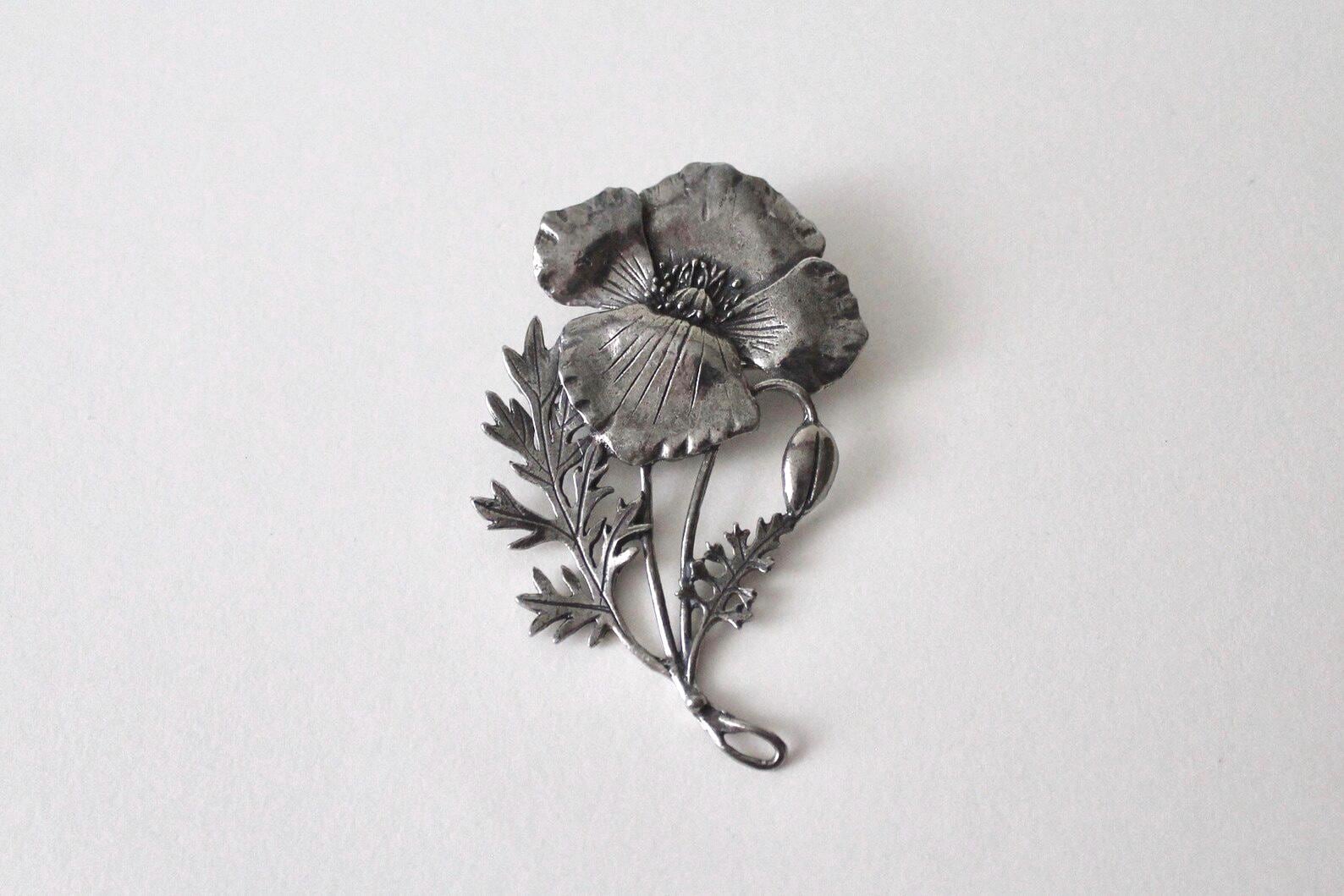 Silver poppy brooch store