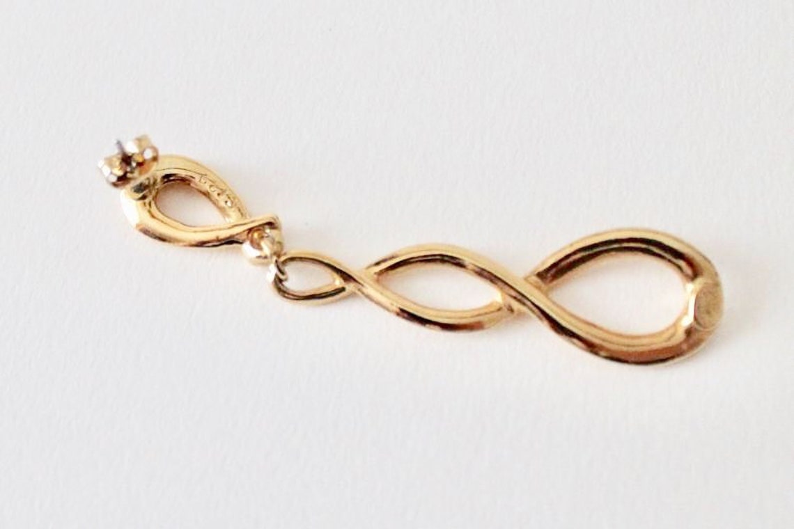 Vintage Sphinx infinity loop gold earrings. Gold tone dangle | Etsy