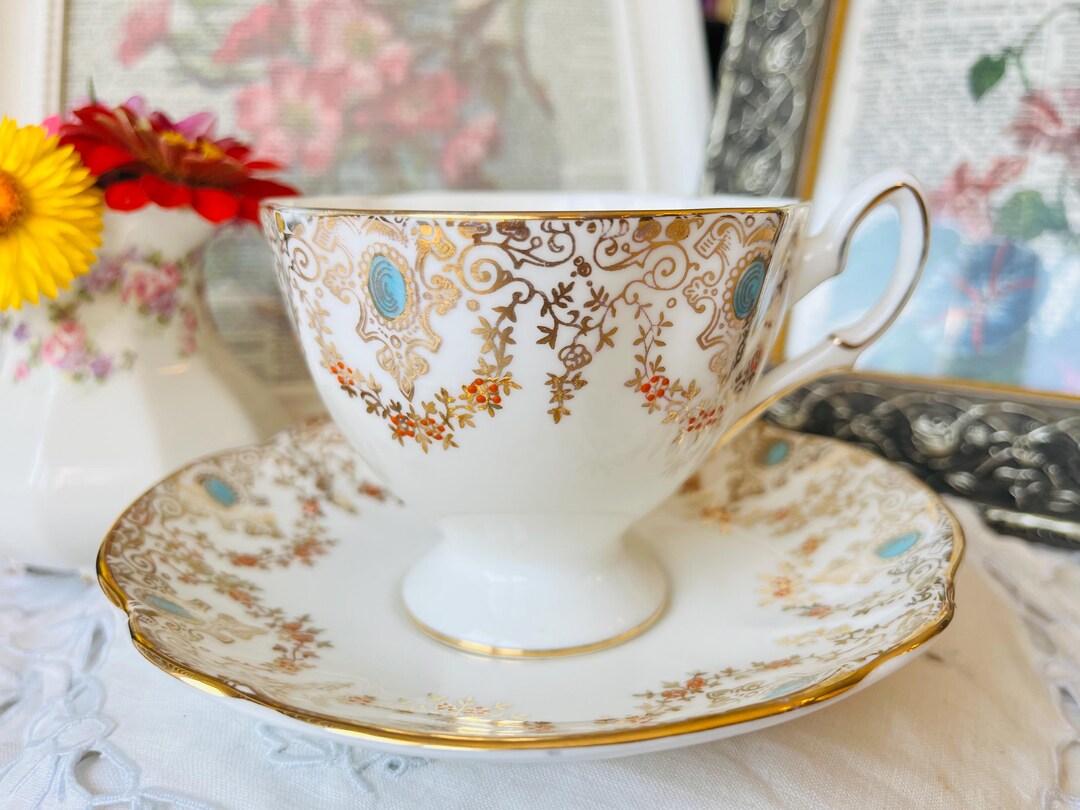 Queen Anne Teacup and Saucer in Gold Chintz Garland and Aqua Blue ...