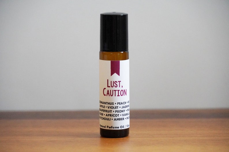 LUST, CAUTION / Osmanthus Peach Iris Apple Jasmine Grapefruit Peony ...