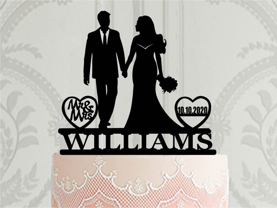 Personalised wedding cake topper bride and groom holding | Etsy