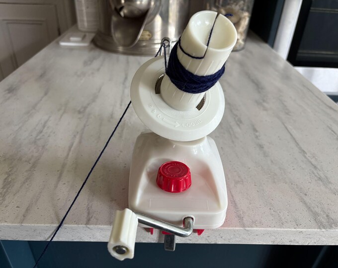 A Vintage Japanese Red and White Plastic and Metal Hand Operated Ball ...
