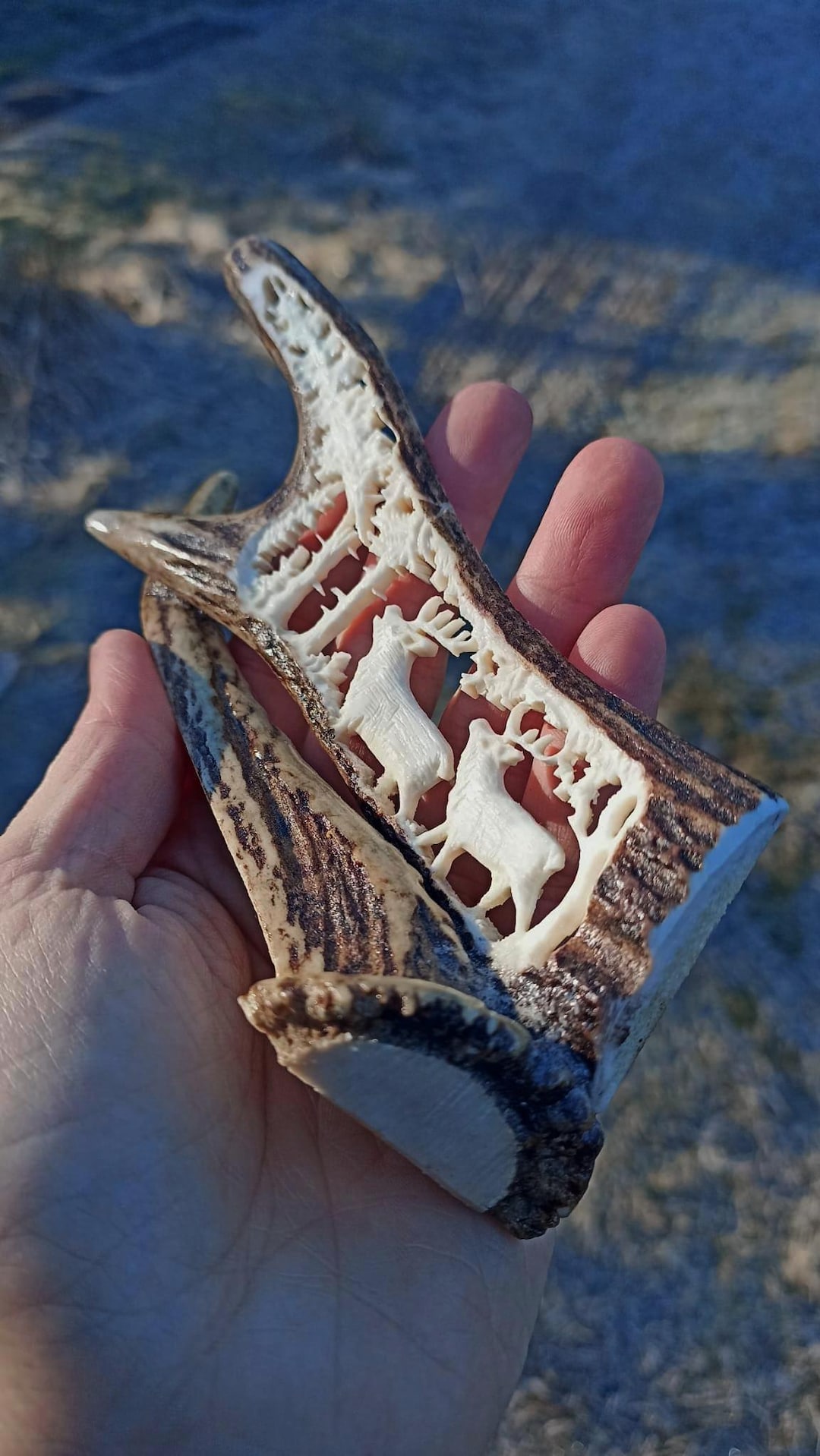 A Hand-carved Antler Statue With a Motif of an Elk in the Woods ...