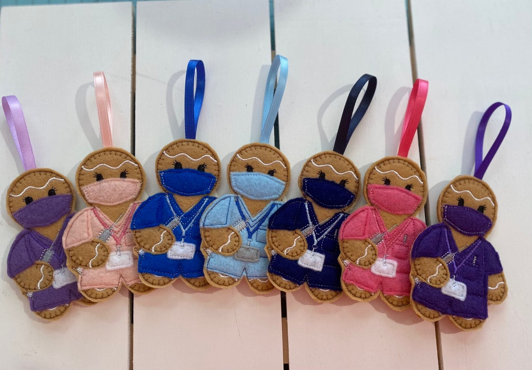 Masked Nurse Practioner Ginger in Scrubs/gingerbread Man Hanging ...
