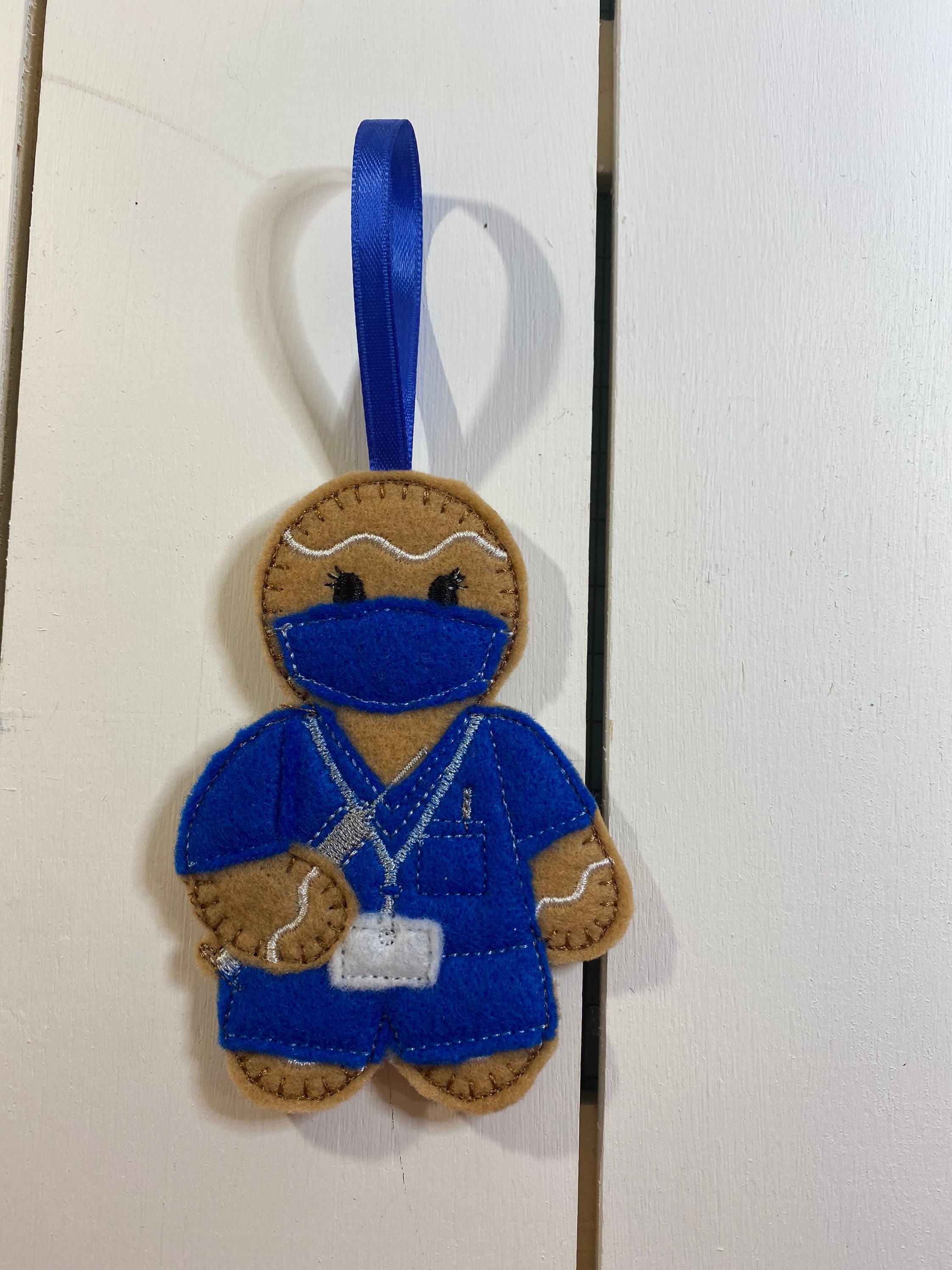 Masked Nurse Practioner Ginger in Scrubs/gingerbread Man Hanging ...