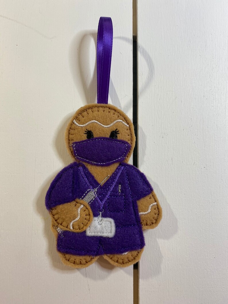 Masked Nurse Practioner Ginger in Scrubs/gingerbread Man Hanging ...