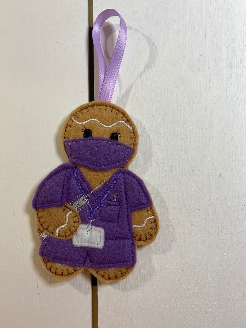 Masked Nurse Practioner Ginger in Scrubs/gingerbread Man Hanging ...