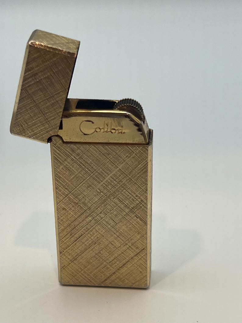 This is a Vintage Colibri Gold-tone Lighter With a Crosshatch Pattern ...