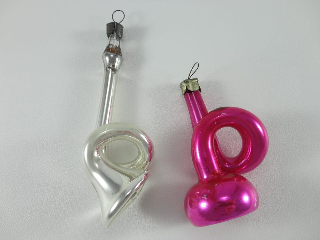 Two Glass Jazz Trumpets. Pink Trombone and Silver Trombone in Retro ...
