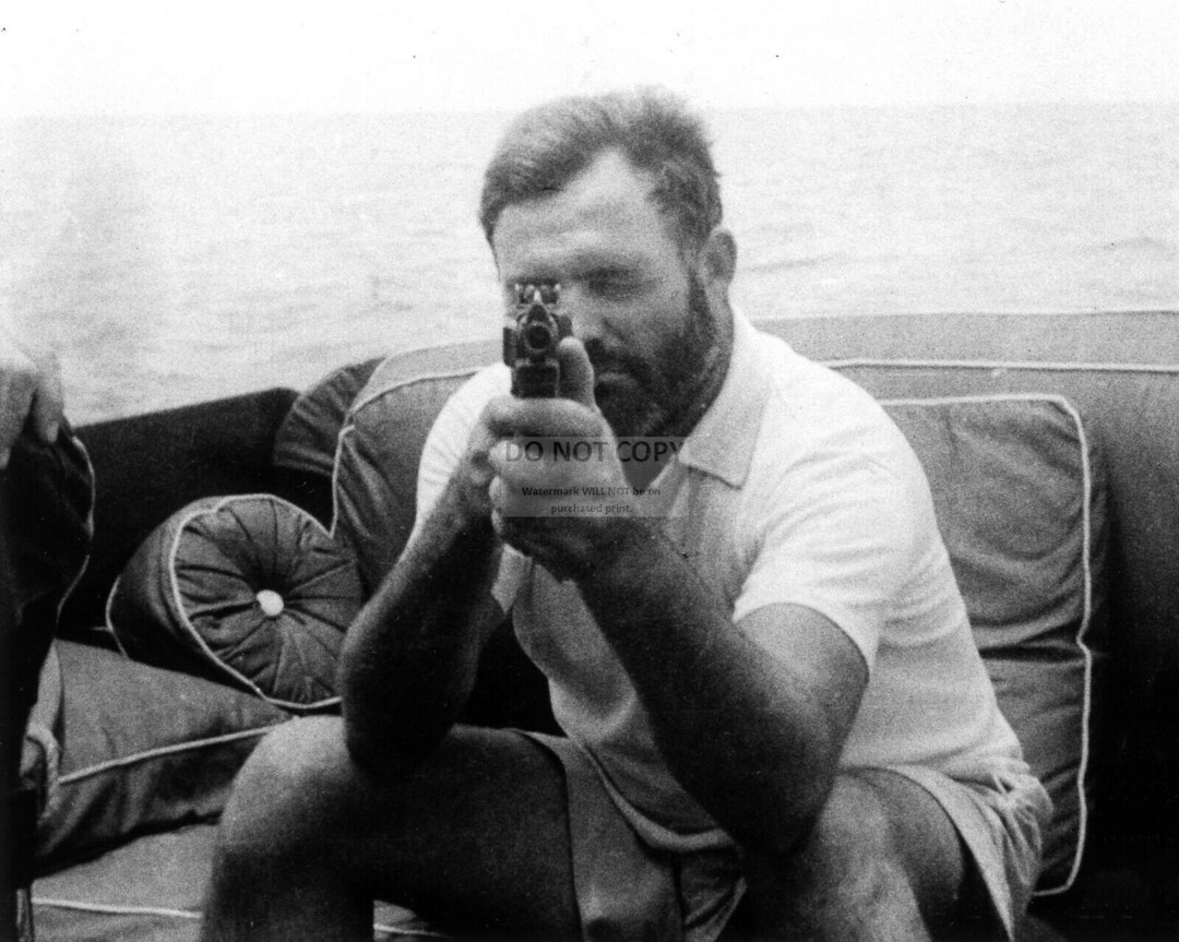 Ernest Hemingway Holding a Tommy Gun Aboard His Yacht the Pilar Circa ...