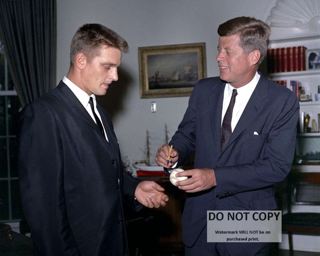 President John F. Kennedy Autographs a Baseball for New York Yankees ...