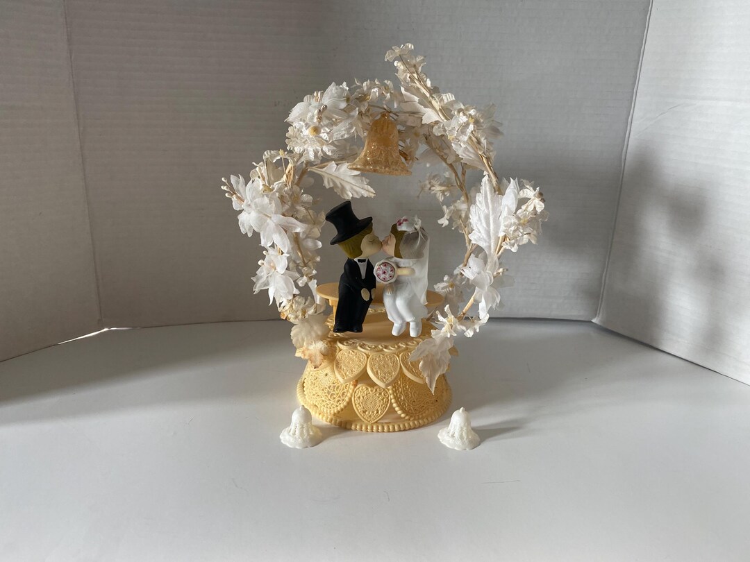 Vintage Wedding Cake Topper With Plastic Bride and Groom Sitting on ...
