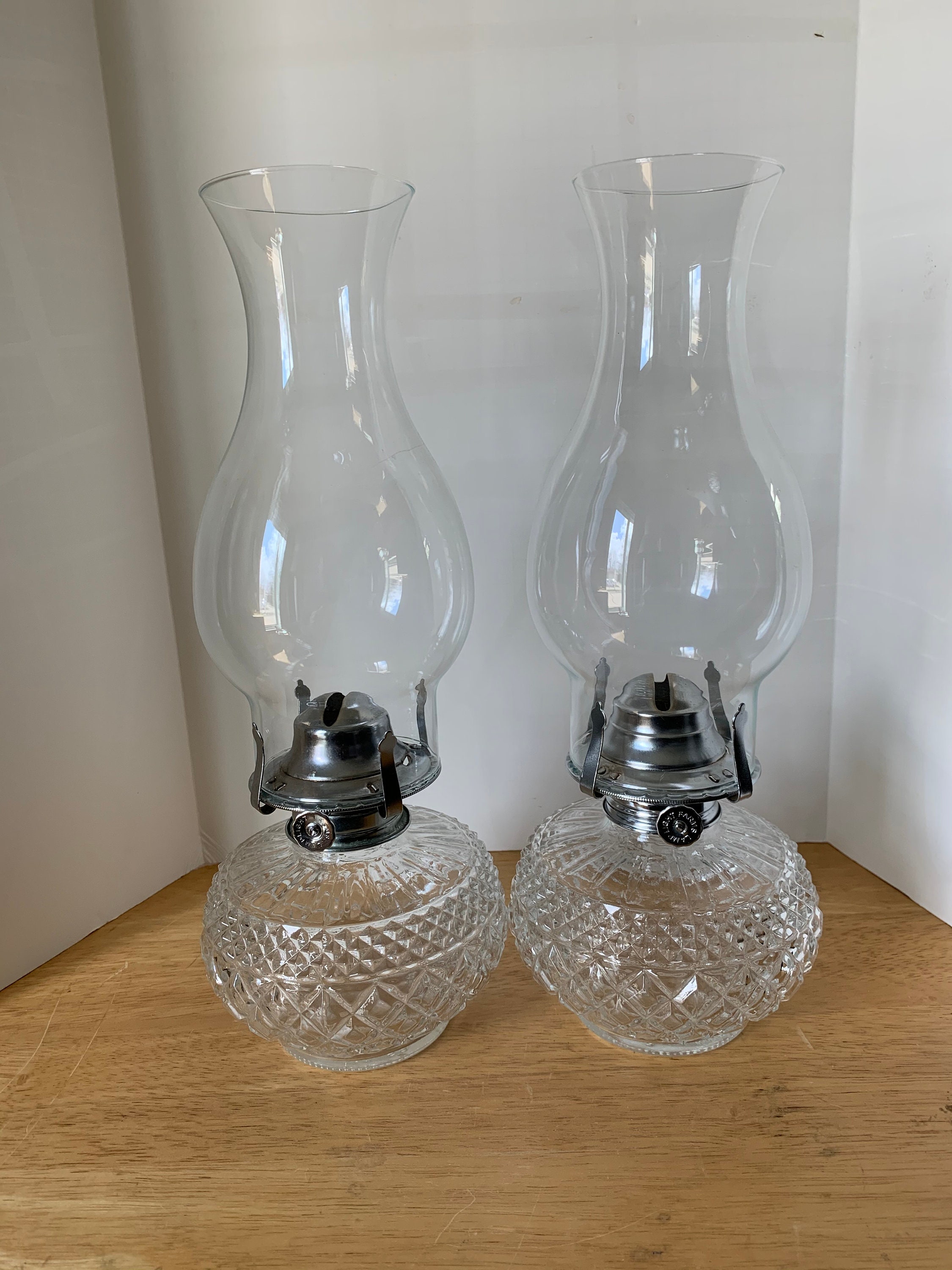 pair of Lamp Light Farms made diamond cut style oil lamps with chimneys ...