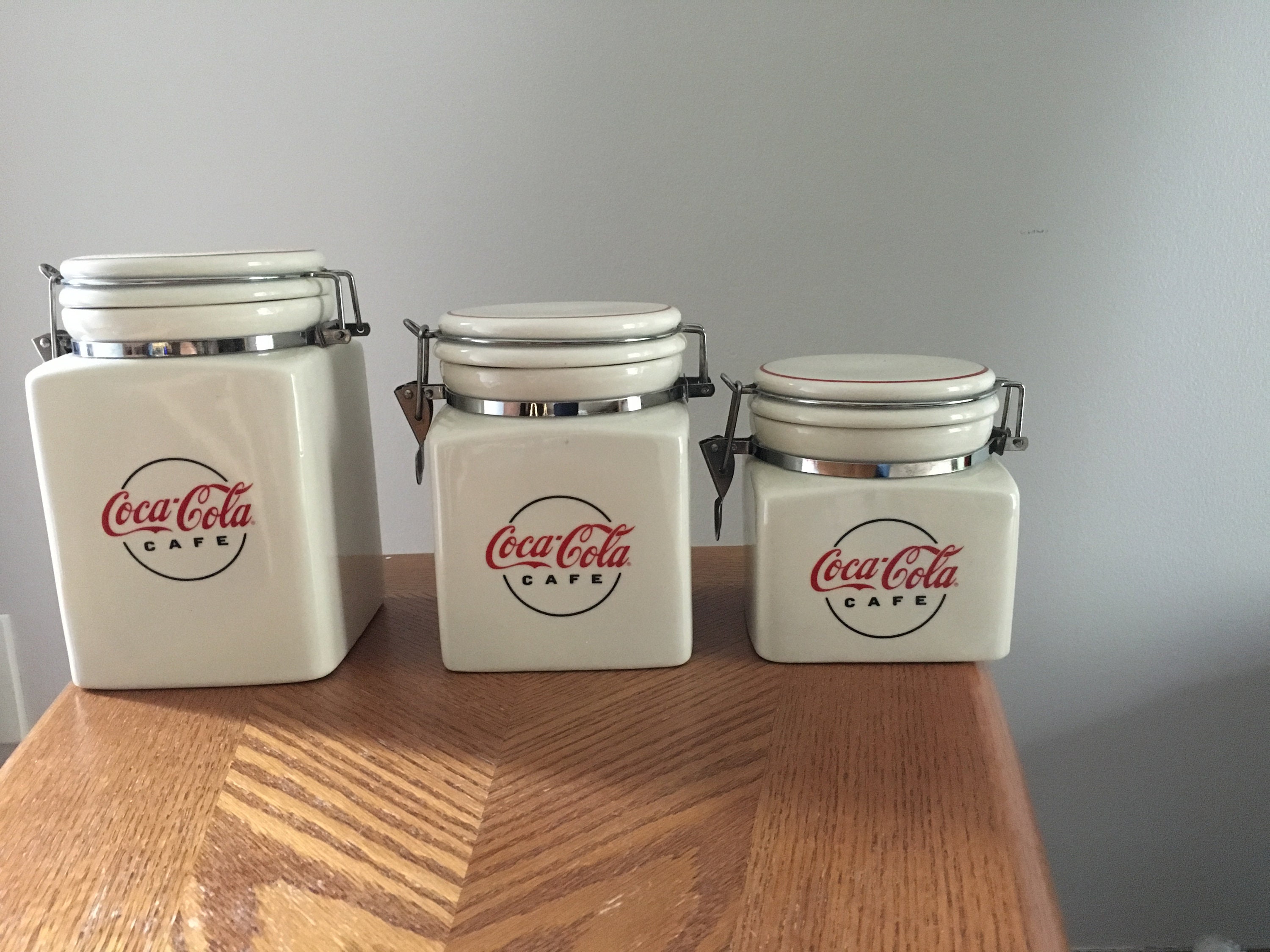 3 Piece ceramic Coc-Cola canister set with locking lids
