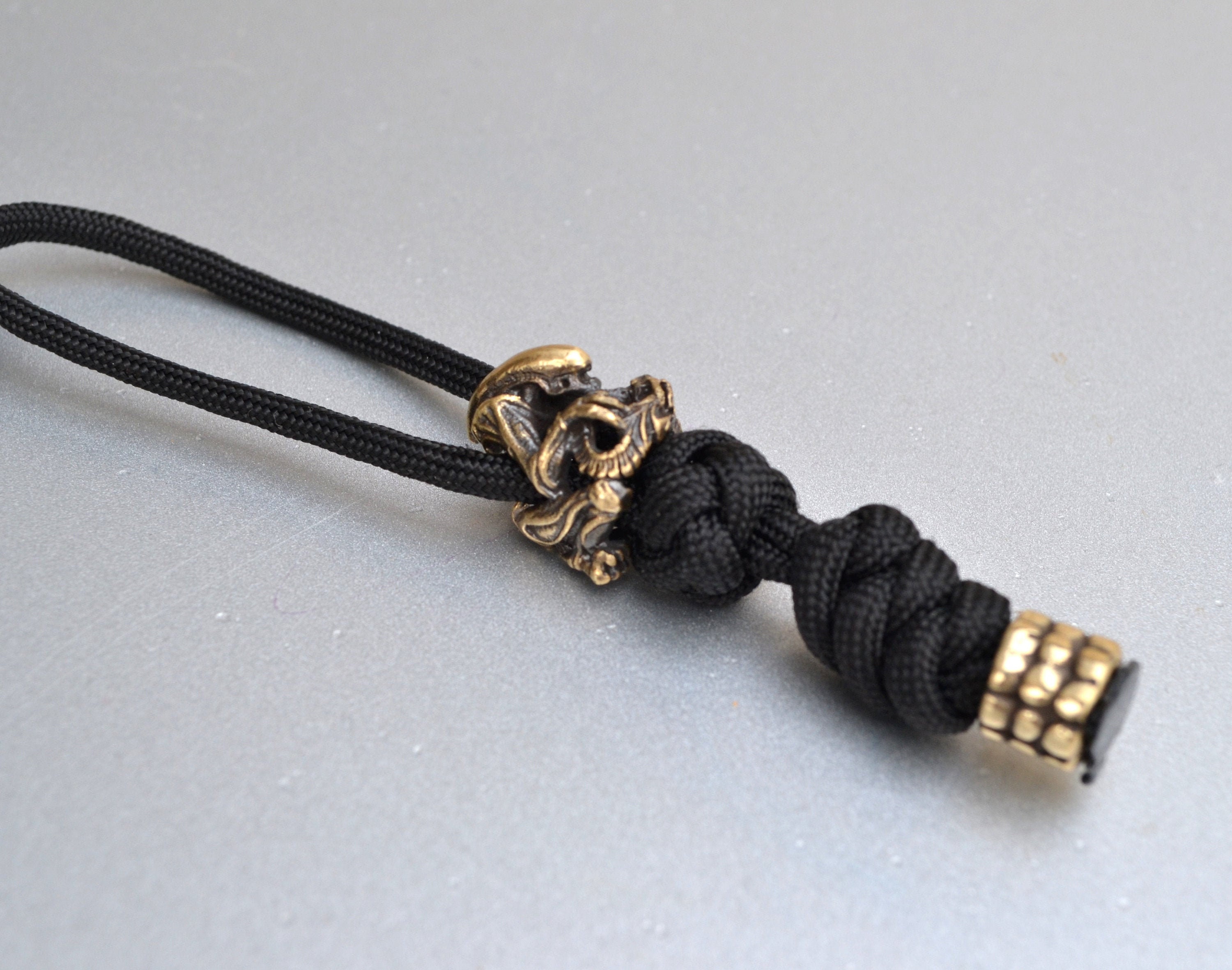Paracord knife lanyard/keychain with Alien brass bead unique | Etsy