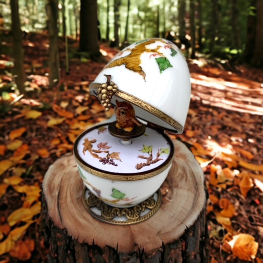 A Delicate Owl Adorns a Musical Egg, a Limoges Porcelain Containing a ...