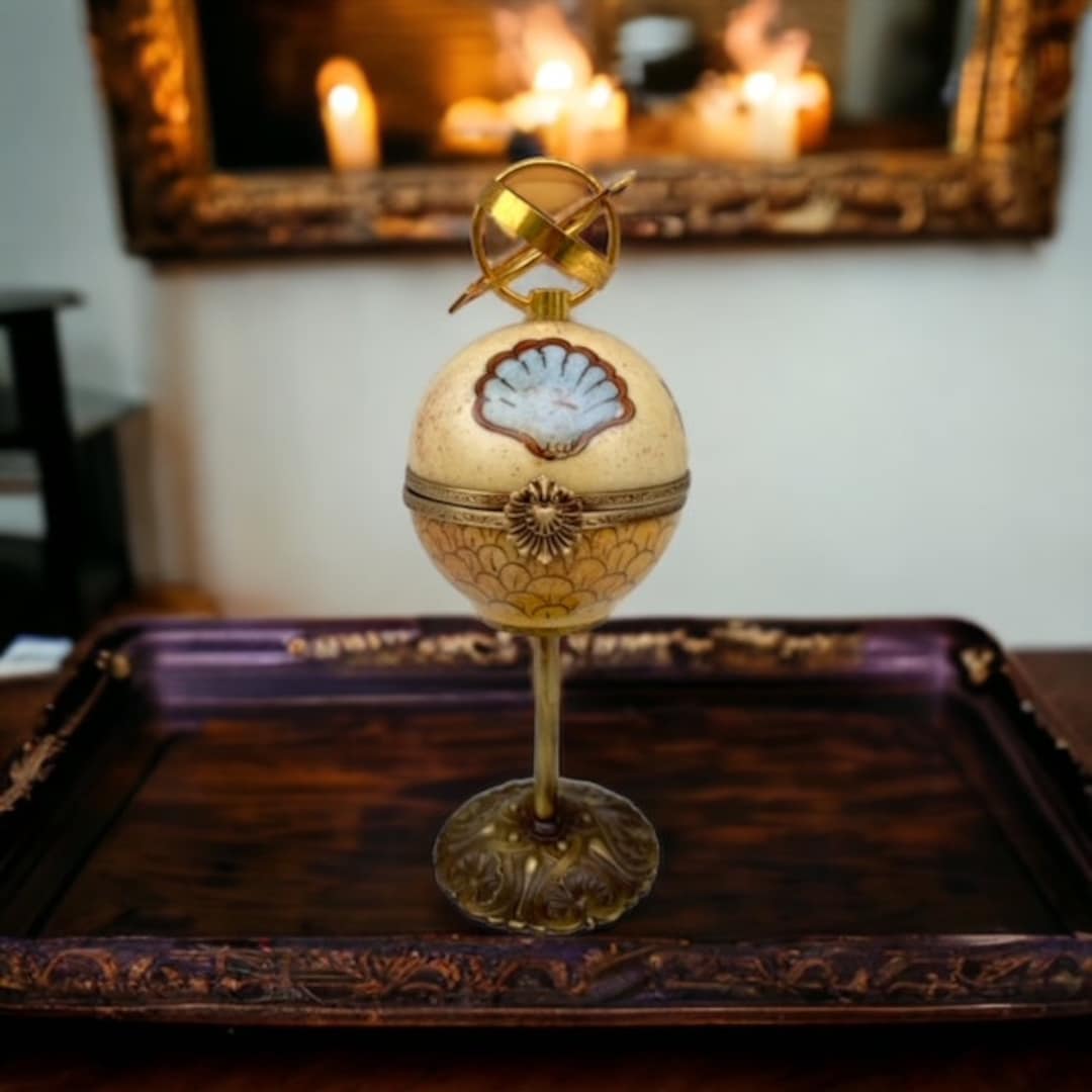 A Limoges Porcelain Ball, Like an Immutable Clock, Ticks off Time With ...