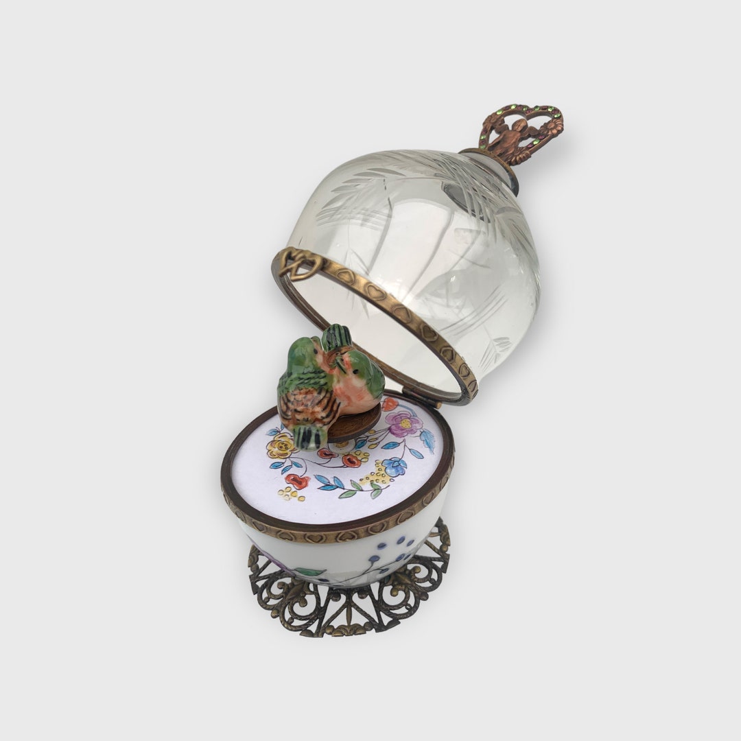 A Singing Bird in Its Crystal Cage Flutters Merrily. White and Purple ...