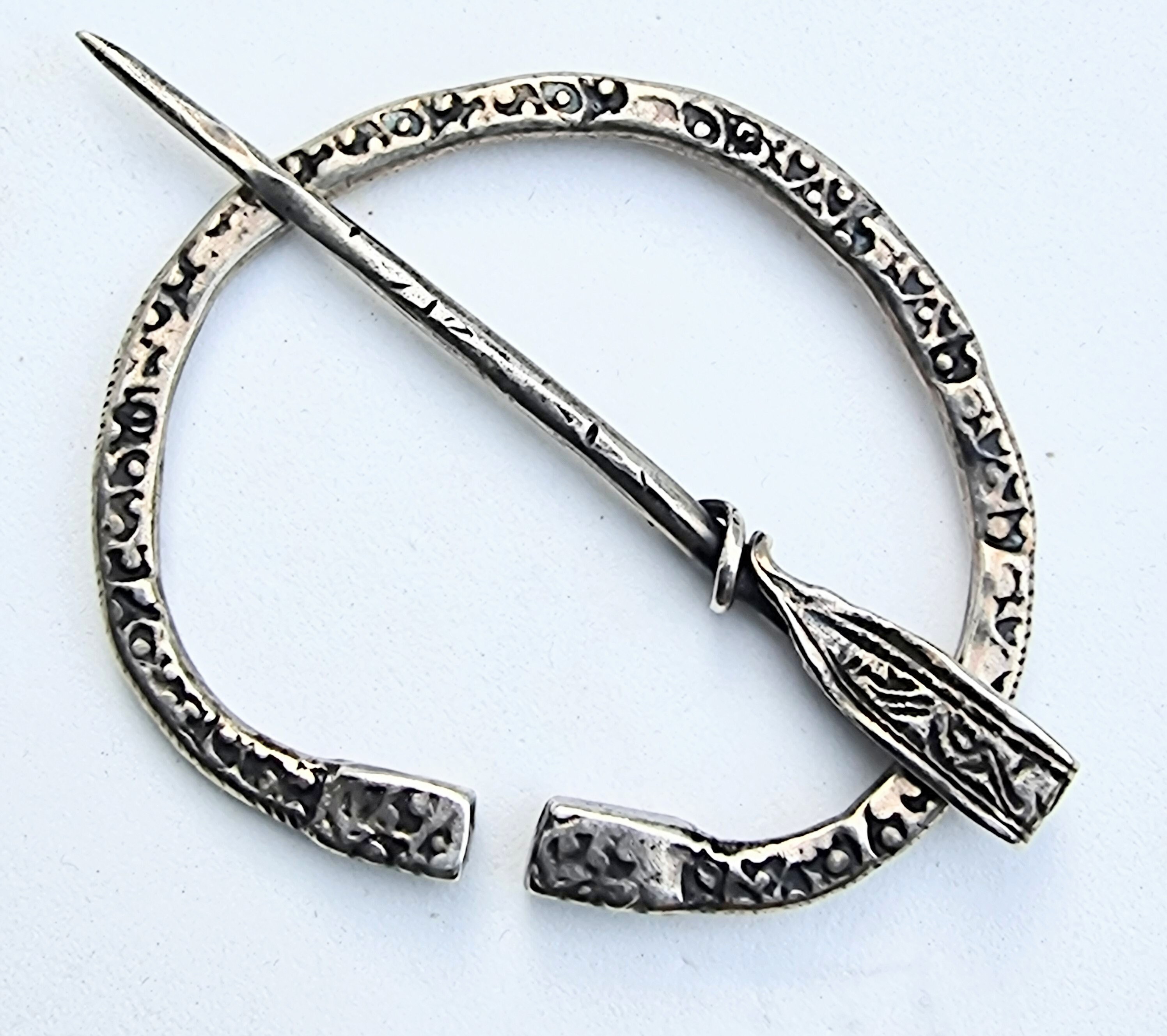 An Early Silver Zoomorphic Penannular Brooch of the Initial Form. LR ...