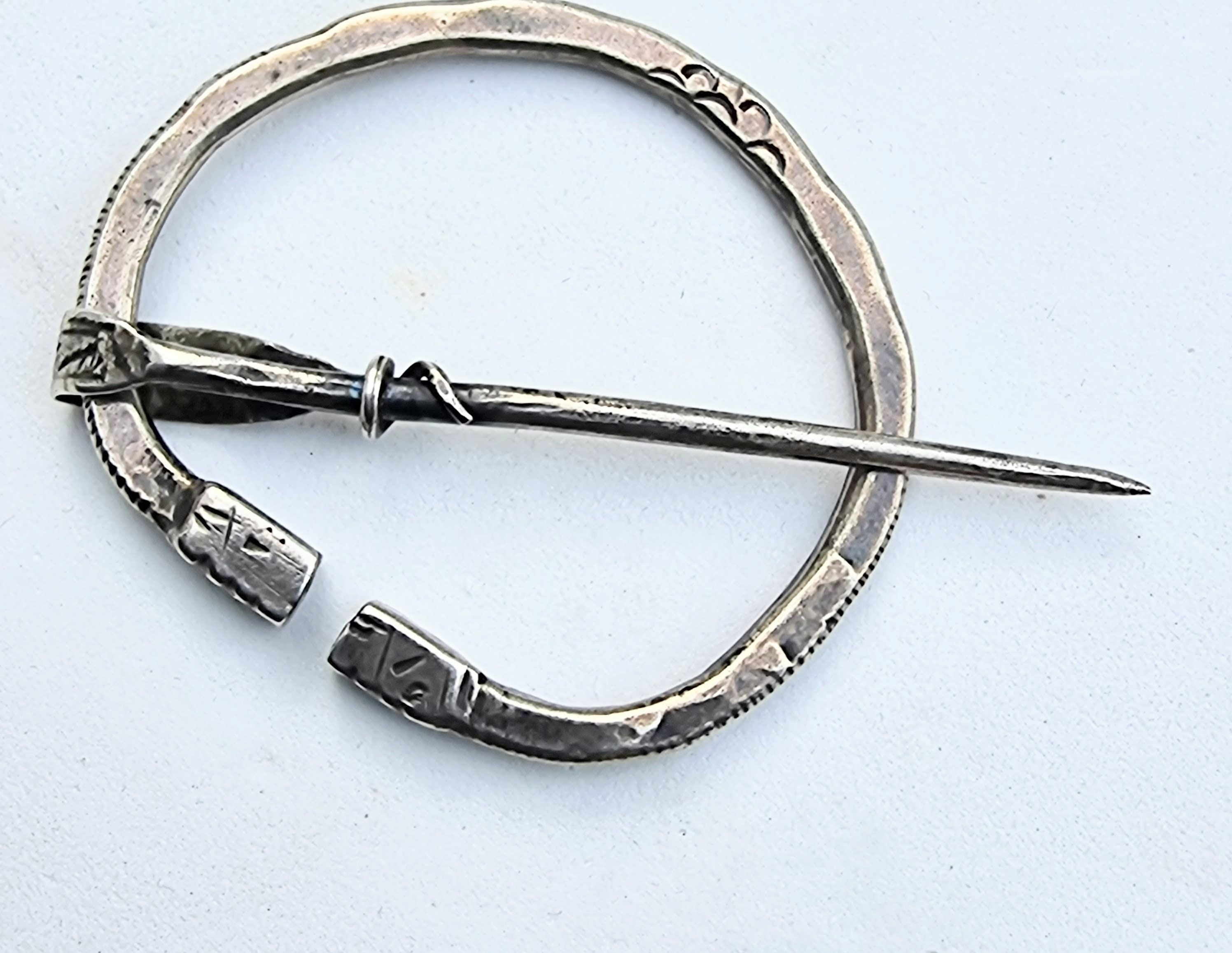 An Early Silver Zoomorphic Penannular Brooch of the Initial Form. LR ...