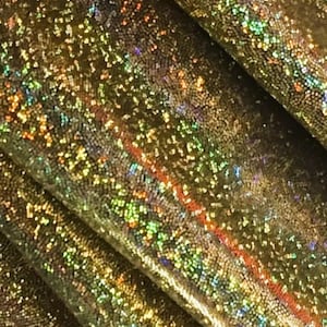 New Gold Hologram Mystique on Black 4 Way Stretch Nylon Spandex Fabric ...