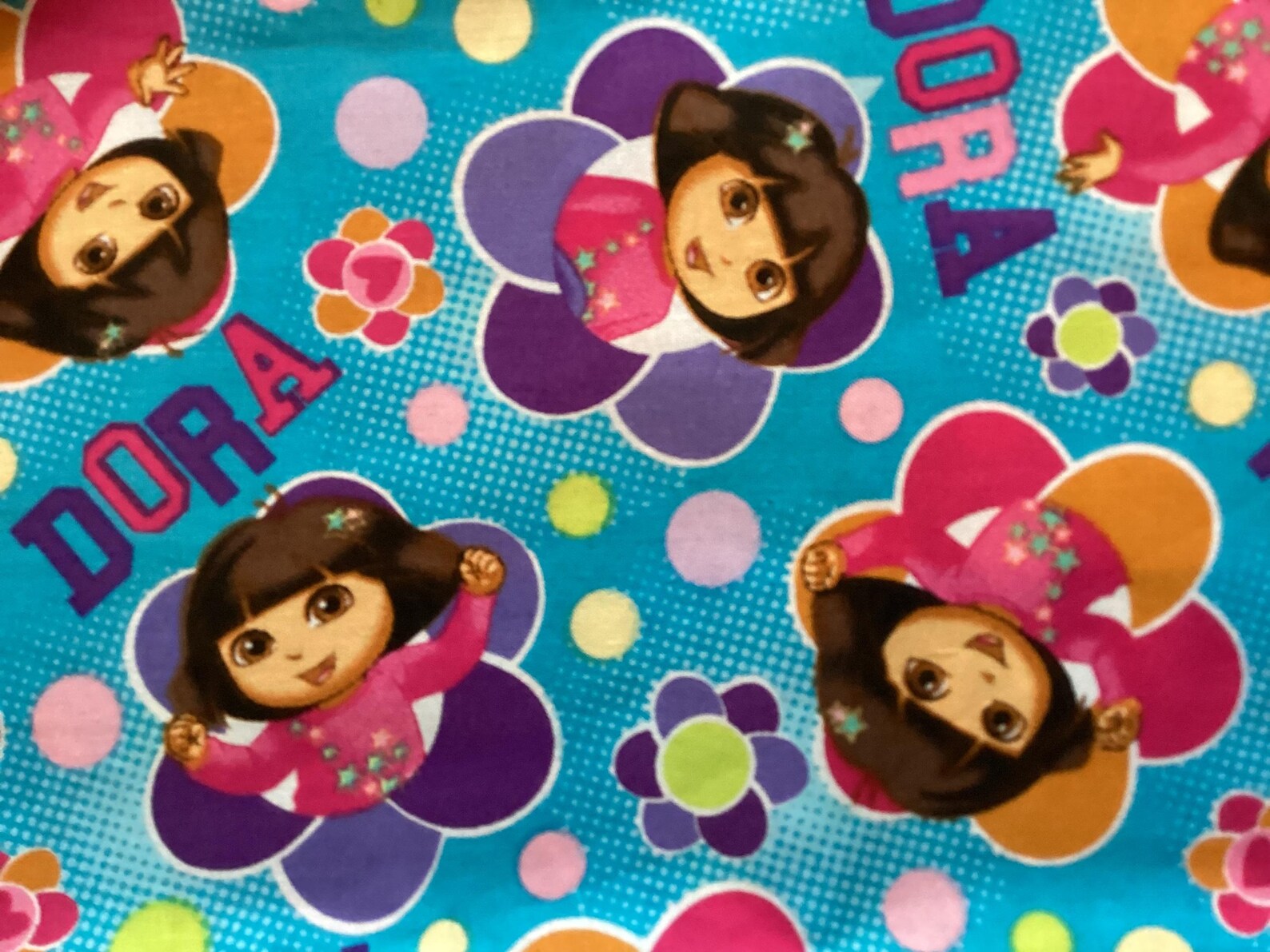 Totally Dora Floral Badges Blue Fabric Quilting Crafting Fabric Kids ...