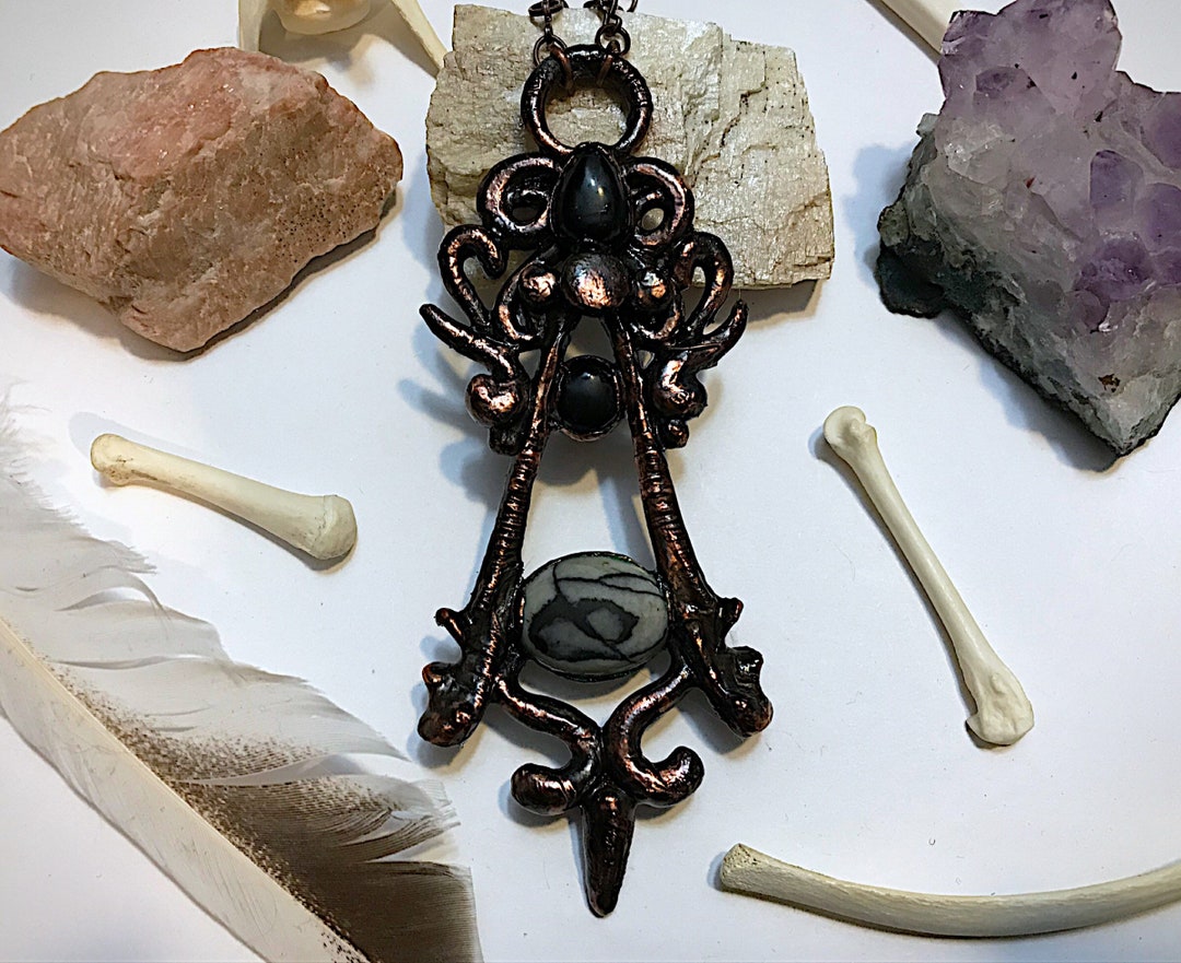 Copper Skunk Ulna Bone Replica, Spiderweb Jasper, and Obsidian Pendant ...
