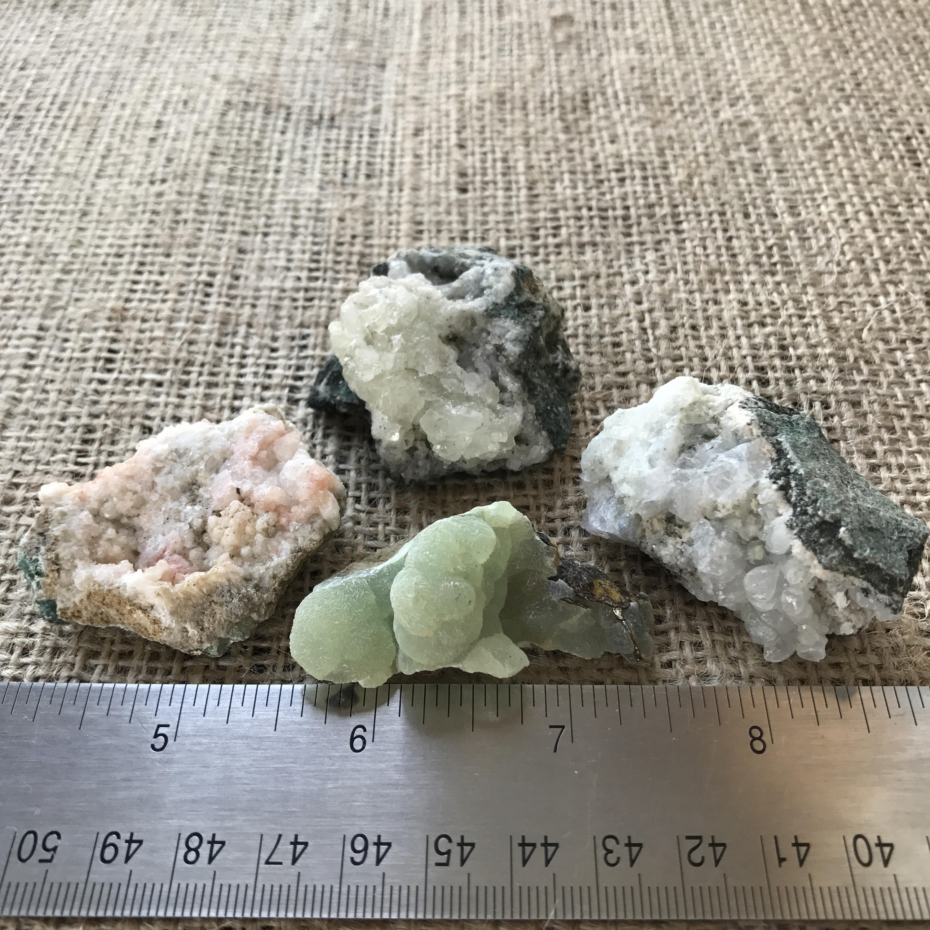 Set of pink/white analcime, prehnite and pyrite, datolite, and ...