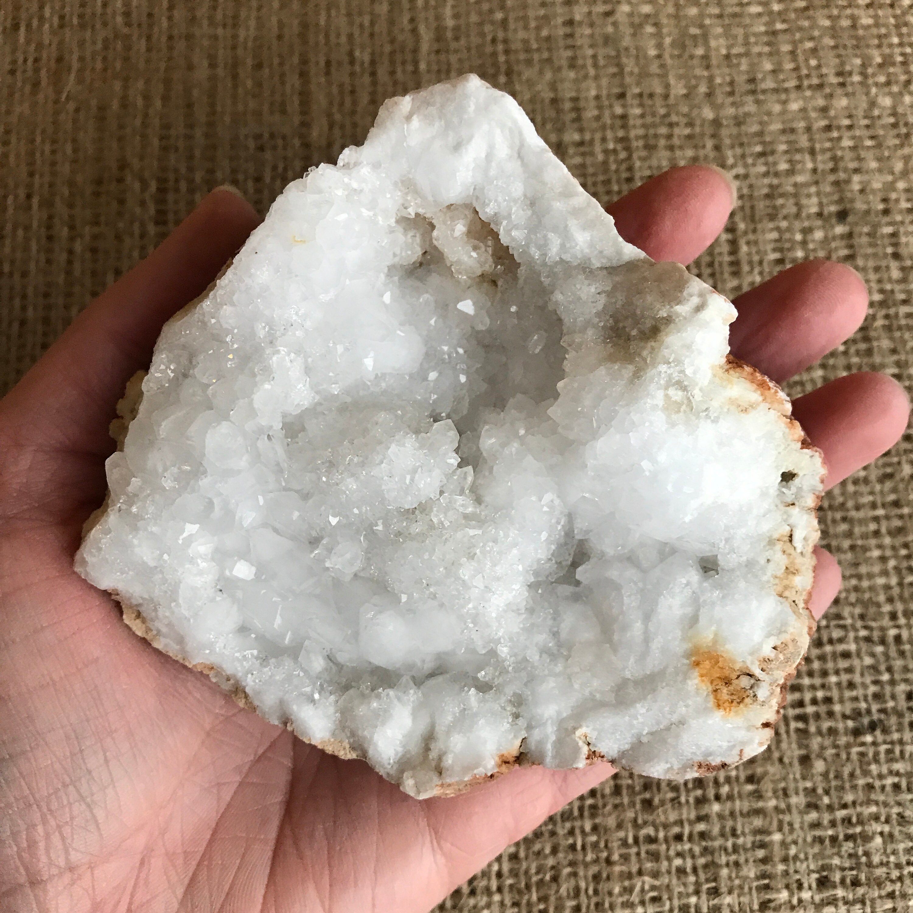 Geode quartz geode piece. The outside glows green and yellow under ...