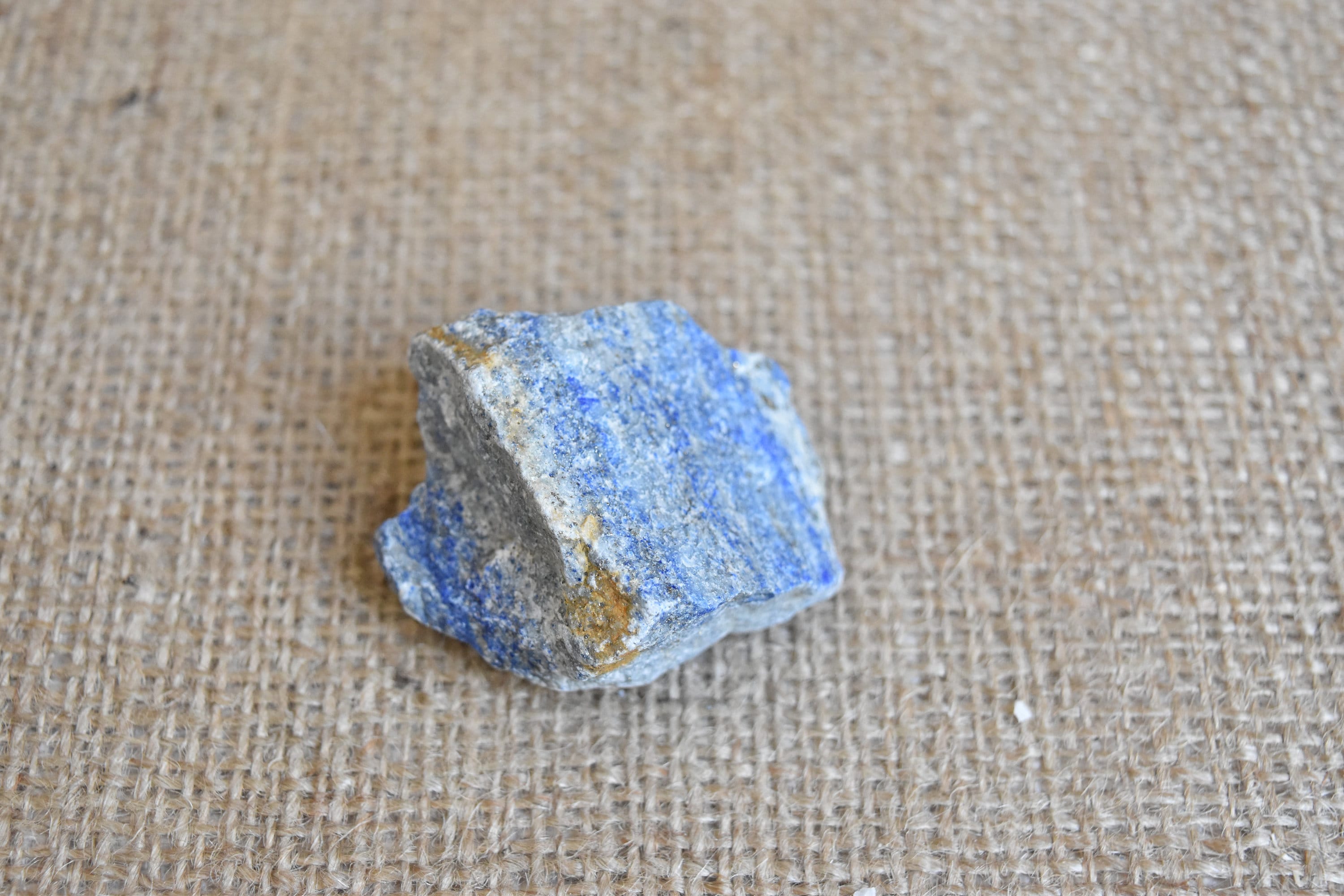 Fluorescent marialite (scapolite), calcite, pyrite, and lapis lazuli ...