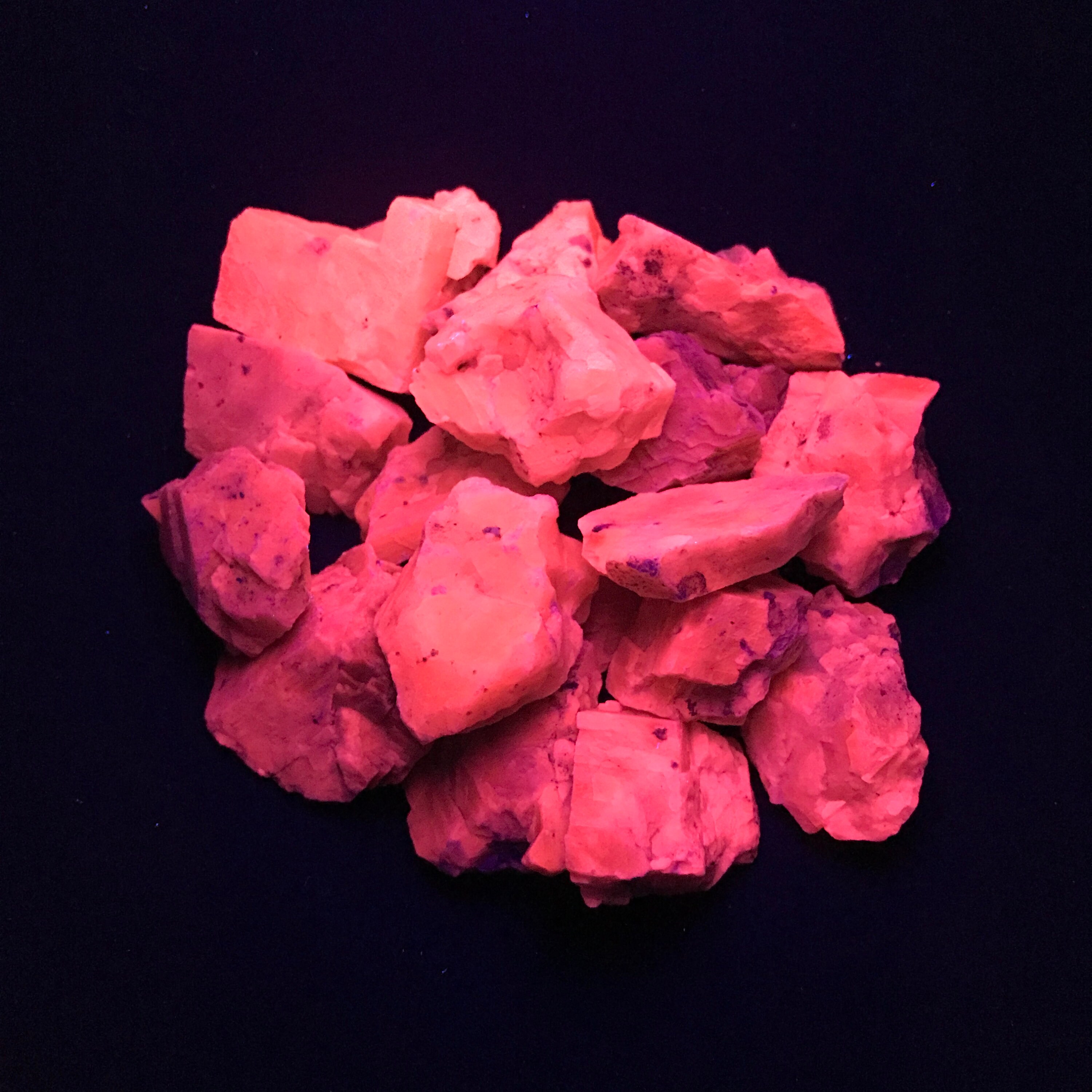 One FLUORESCENT salmon CALCITE crystal. Sterling Hill Mine- New Jersey, Nj.