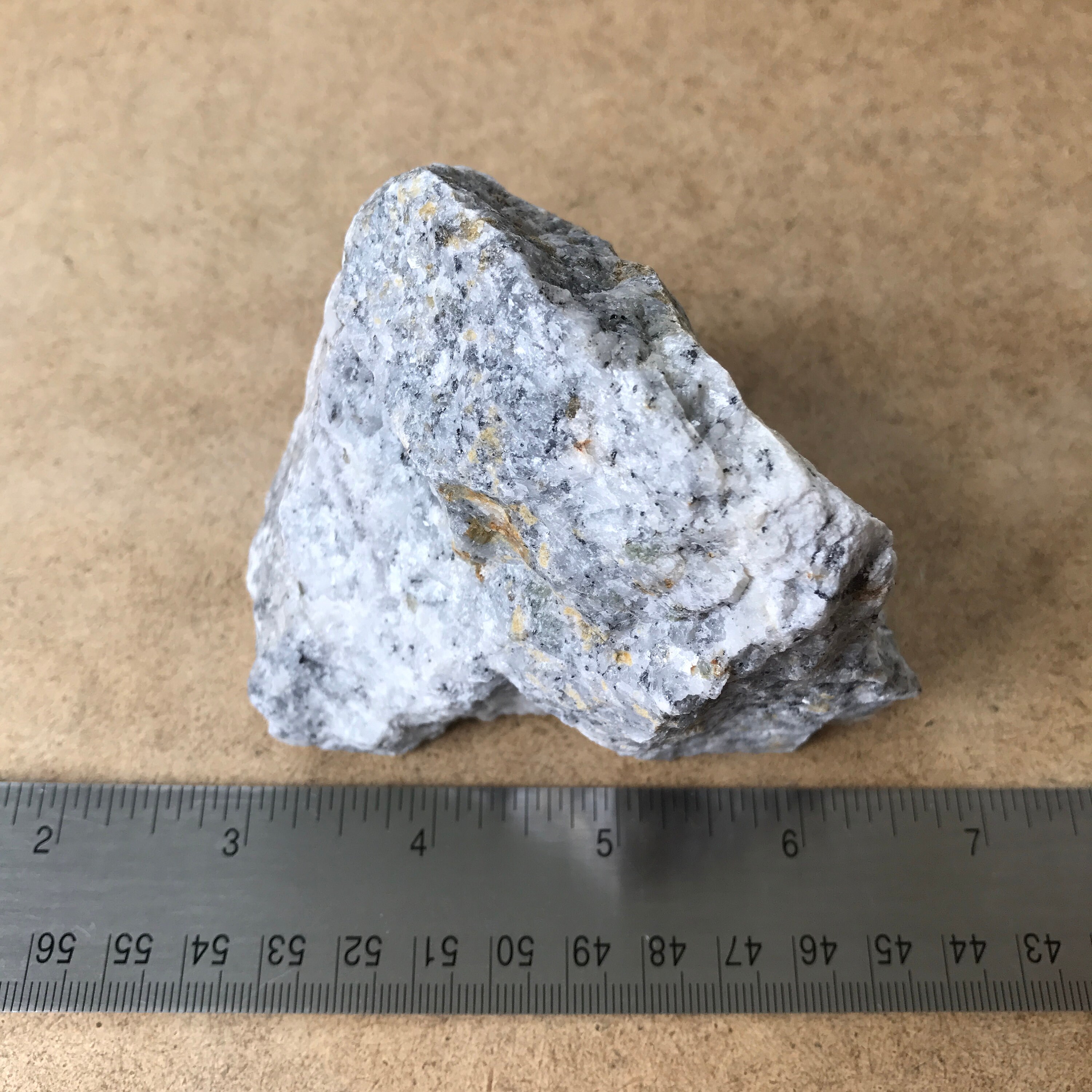 Fluorescent norbergite and diopside in Franklin marble. With mica. UV ...