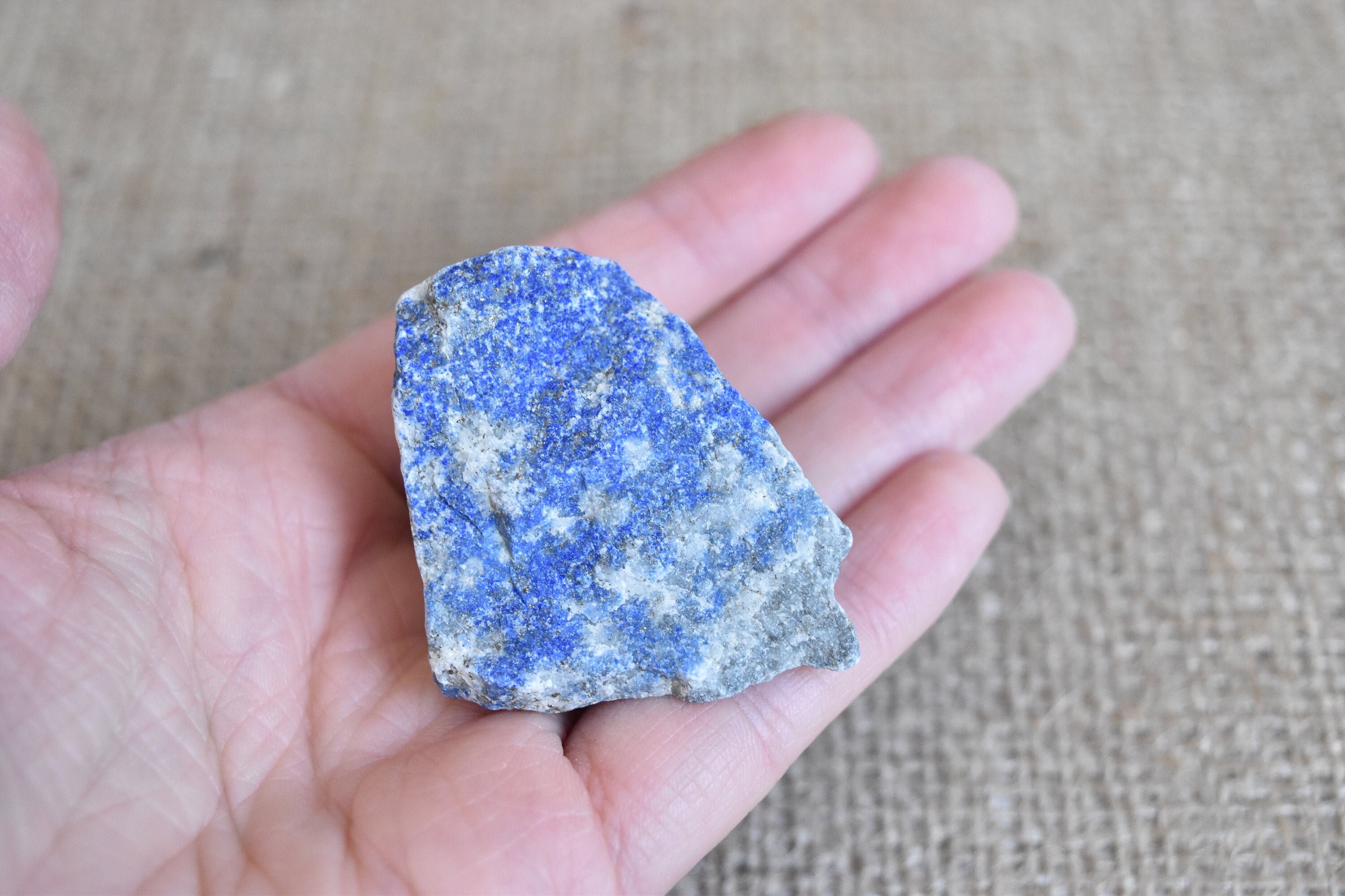 Fluorescent marialite (scapolite), calcite, pyrite, and lapis lazuli ...