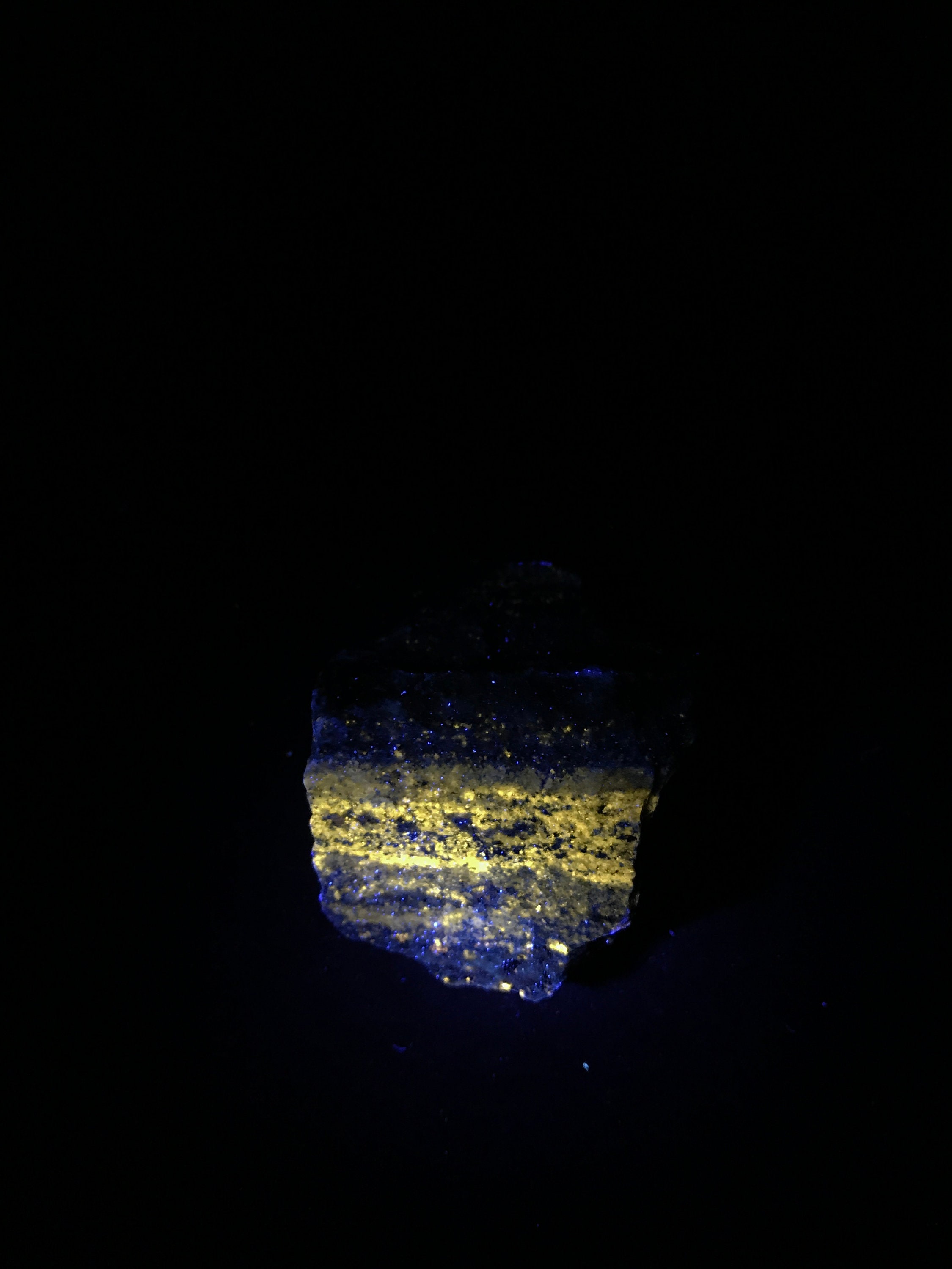 Fluorescent marialite (scapolite), calcite, pyrite, and lapis lazuli ...