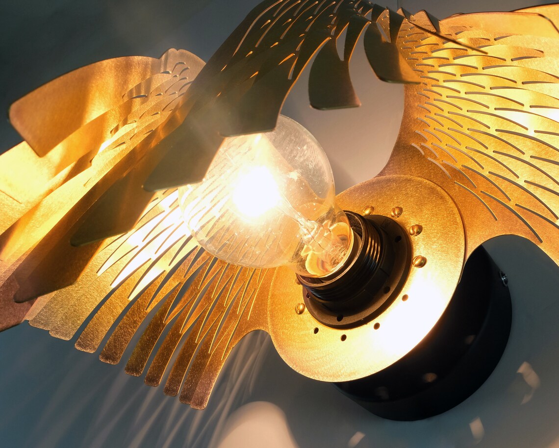 Brass wing wall sconce Bird shadow light Golden light | Etsy