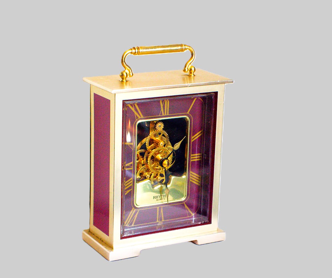 Floating Skeleton Clock - Rhythm Quartz Mantel Table Carriage Clock ...