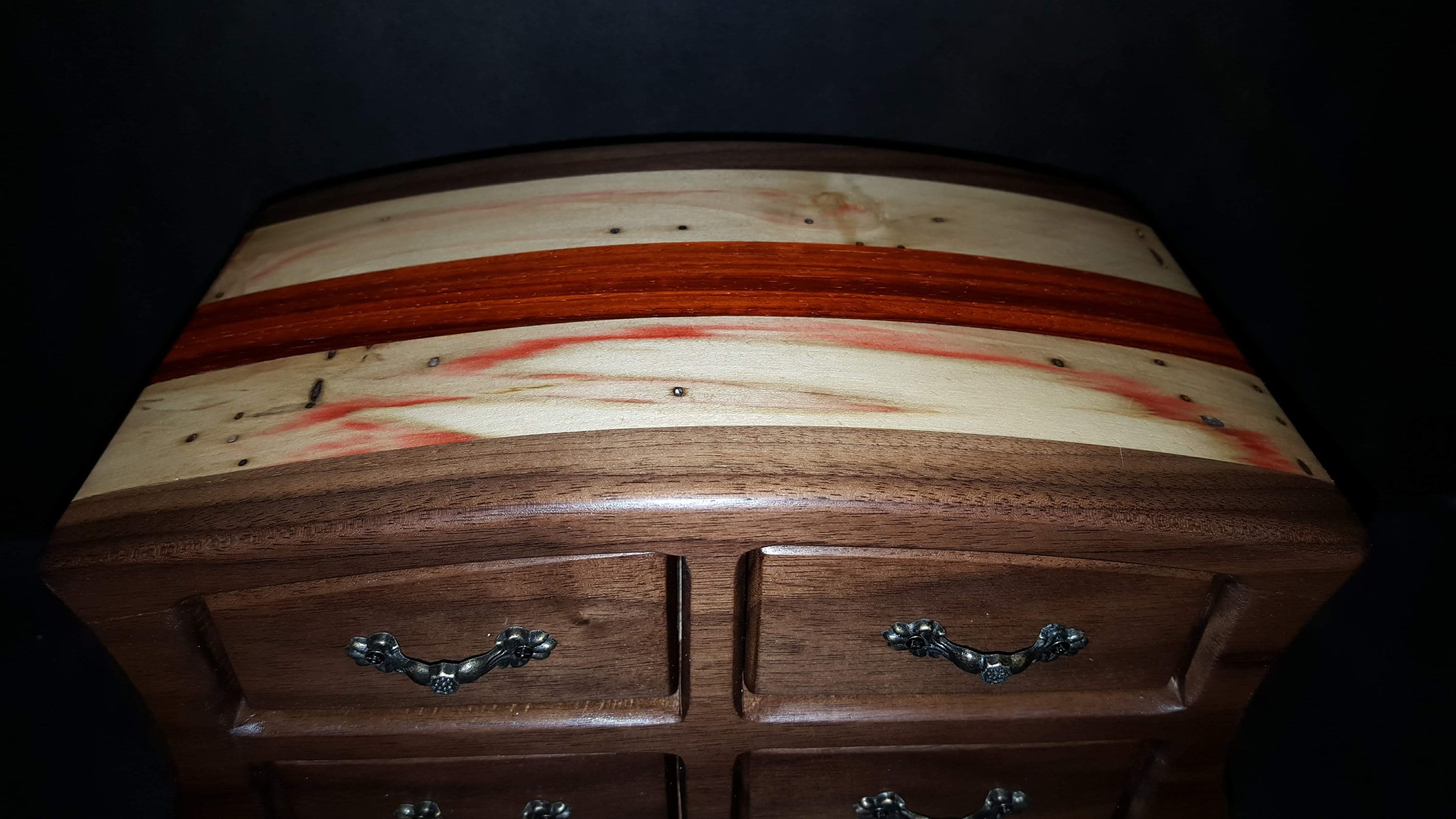 Jewelry box made from black walnut, red flame box elder, and padauk