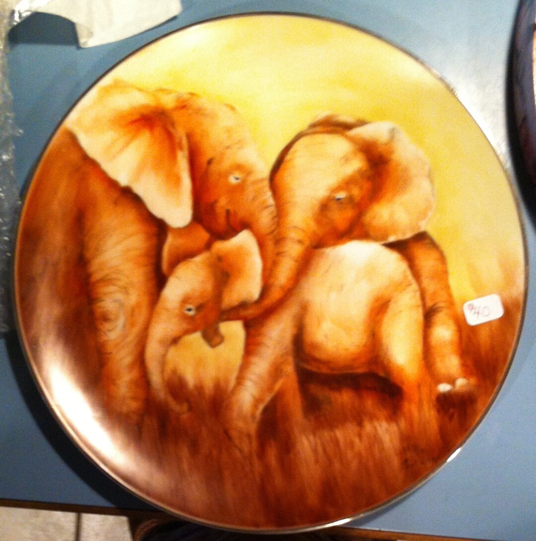 A Cute and Playful Family of Elephants on a Porcelain Plate by Featured ...