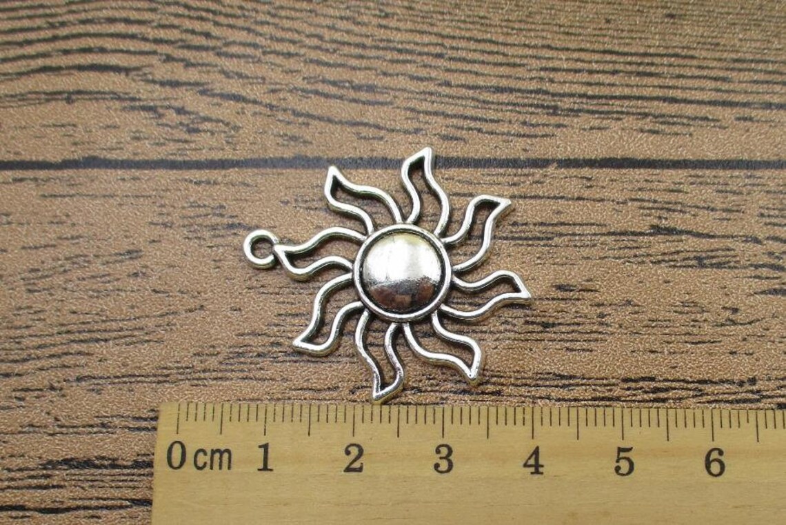 12 dijes de sol tono plata antigua-RS499 | Etsy