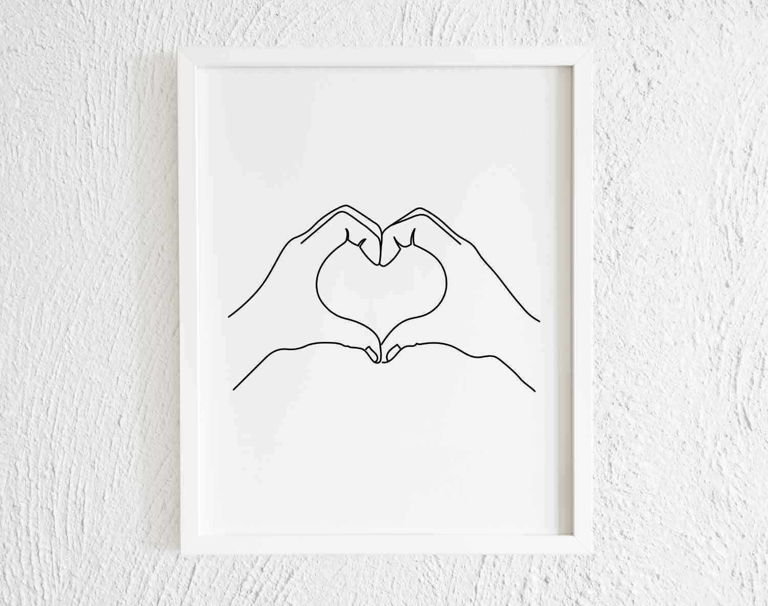 Two Hands Holding A Heart Drawing