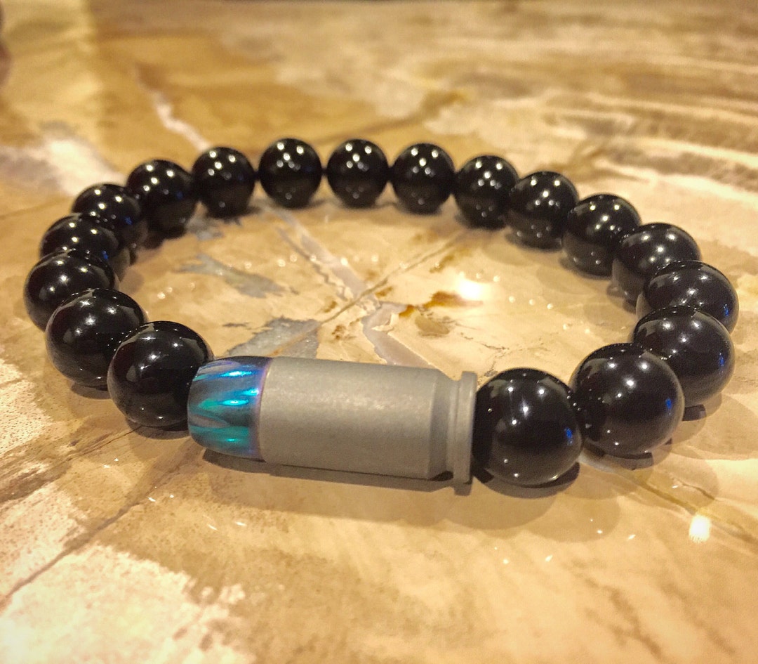 The Protector - Oxidized Bullet Coating a Titanium Casing Accent With ...