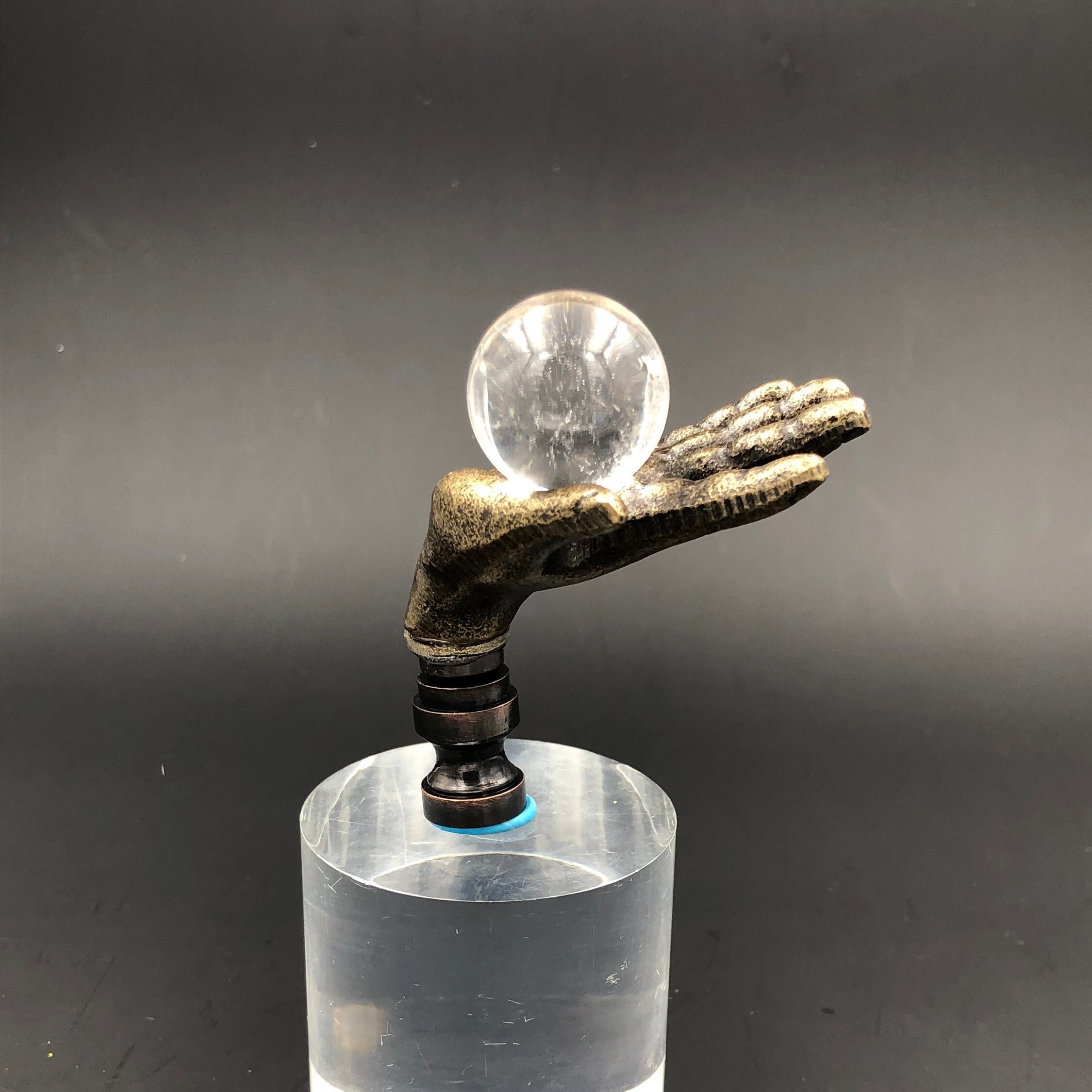 Hand Holding Sphere