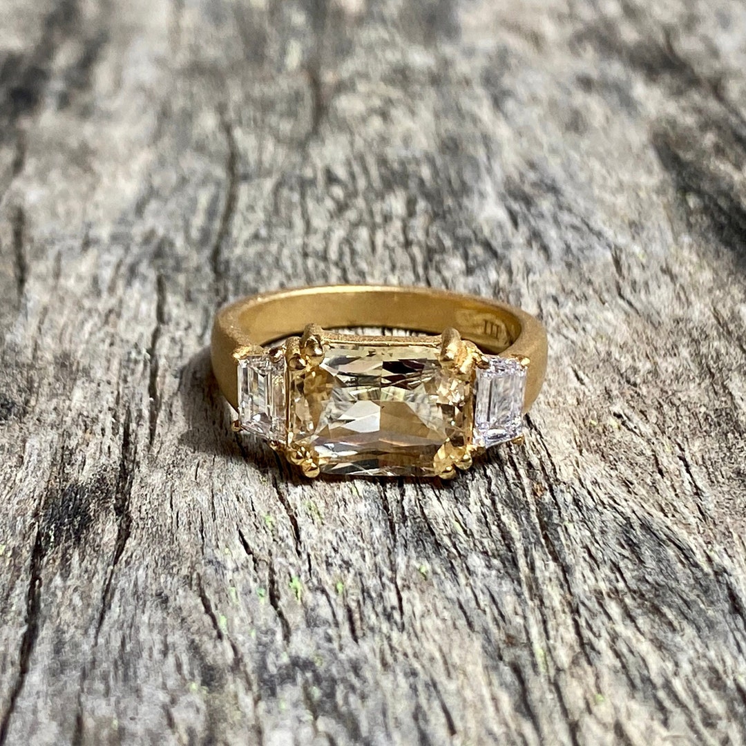 18 Kt Matt Finish Yellow Sapphire Ring With Trapezium Side Diamonds FG ...