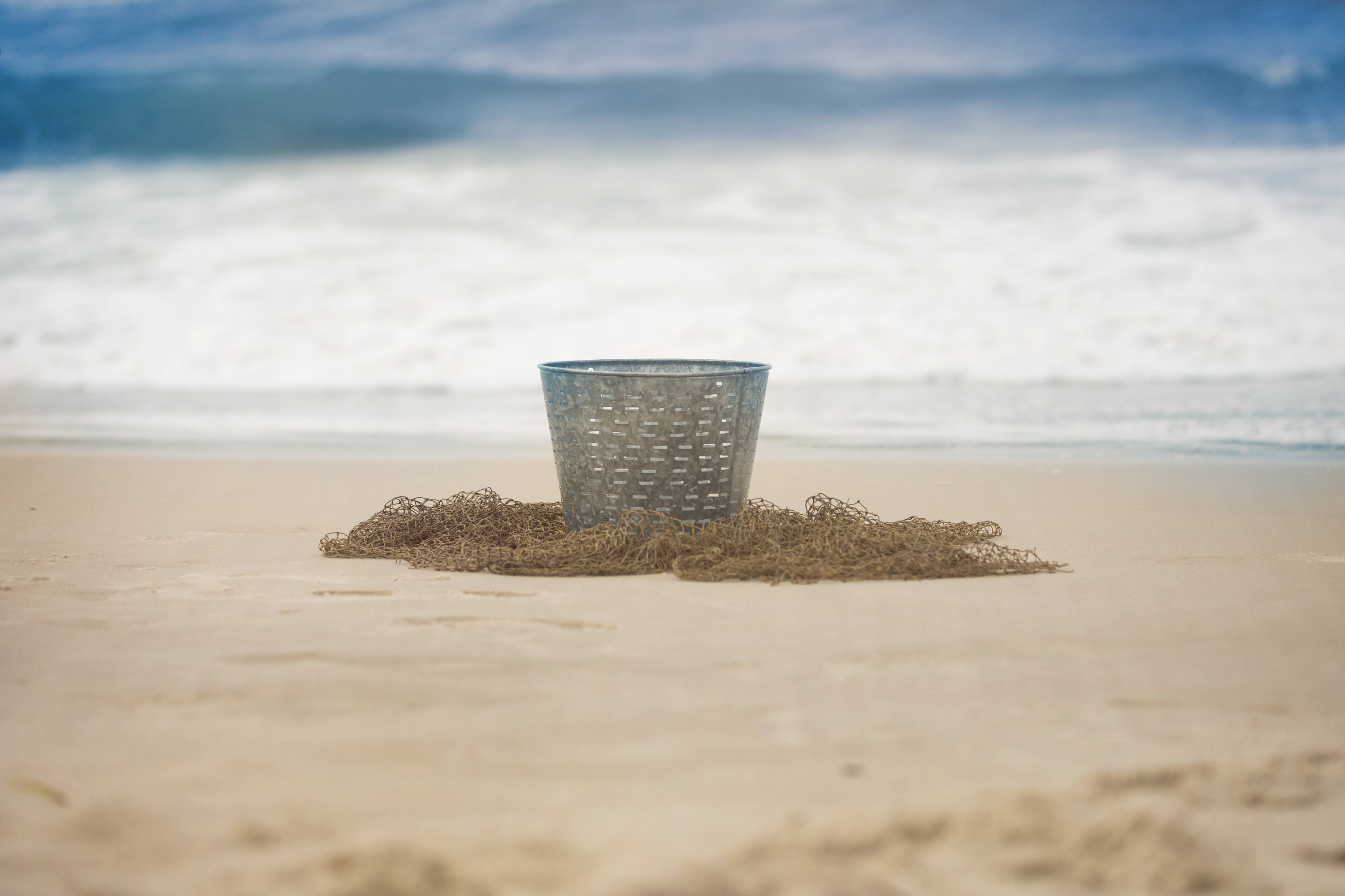 Basket by the Beach With Fishing Net on the Ocean With Waves Digital ...