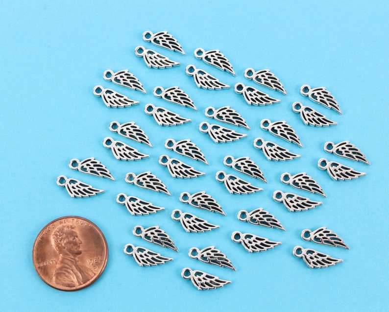 Tiny Angel Wing Charms Double Sided Filigree Wings 13mm Long - Etsy