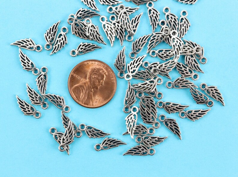 Tiny Angel Wing Charms Double Sided Filigree Wings 13mm Long - Etsy