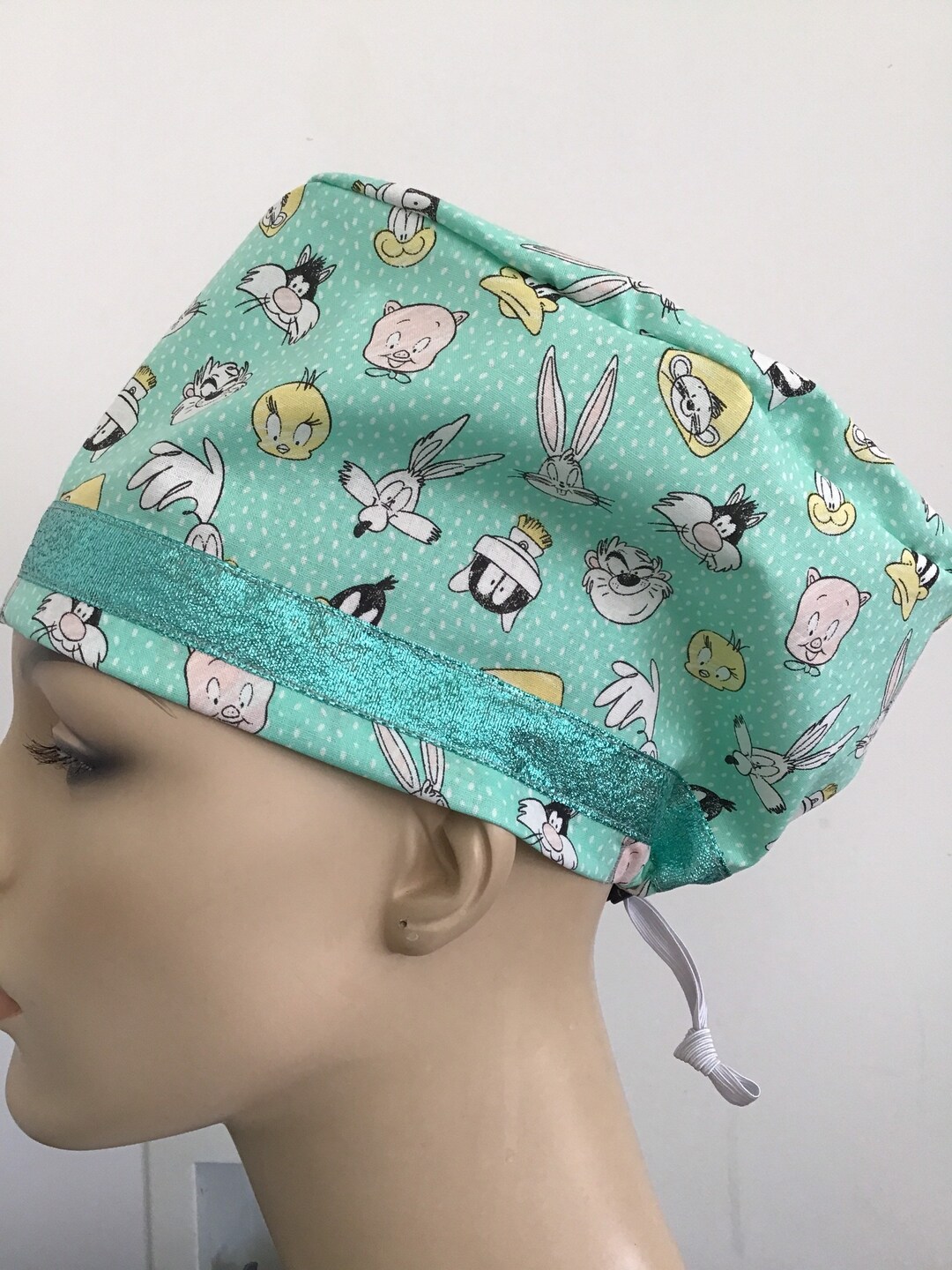 SCRUB HAT FEATURING Shimmer Ribbon With Cartoons on a Pastel Green ...