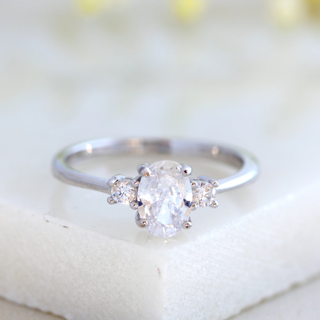 Classic Oval Cut Three Stone Engagement Ring in Sterling Silver ...