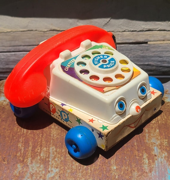 Fisher Price Chatter Phone c. 1960s 1970s vintage toys rotary Phone classic pull Toy wood Base plastic Wheel childrens retro copr. 1961 74 Etsy Canada