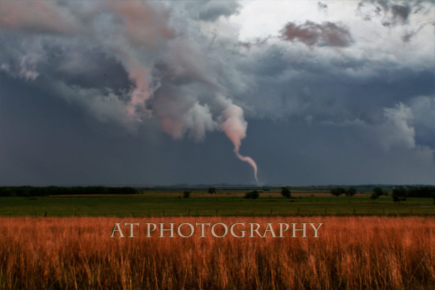 A Rope Tornado Forms on the Kansas Prairie From a Rainy Day Storm Cloud ...